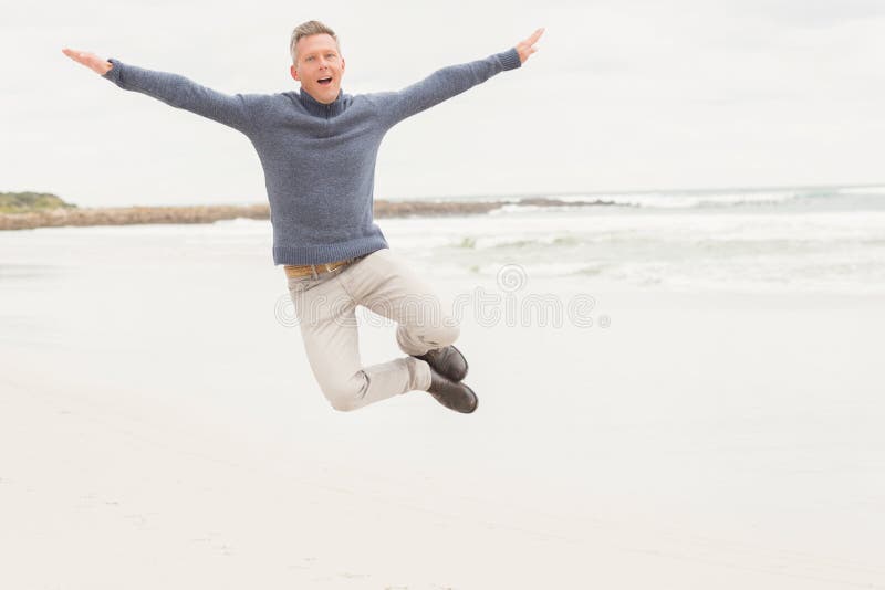 Man Standing with Arms Out Wide Stock Photo - Image of ocean, sunny ...
