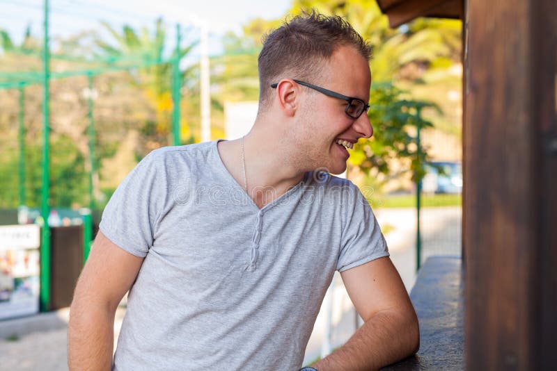 Man Standing Behind Bar and Ordering Something. Stock Image - Image of ...