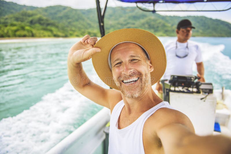 A Man Standing on Boat when Having a Great Tour Stock Image - Image of ...