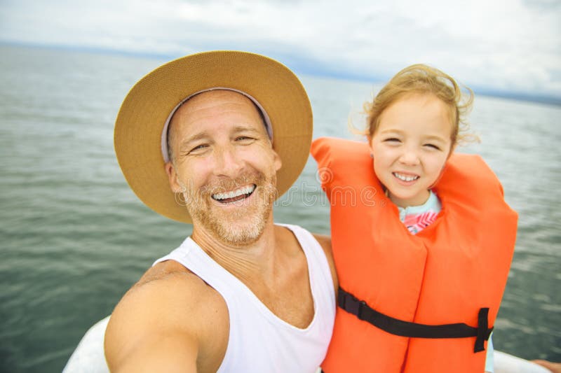 Man Standing on Boat when Having a Great Tour with Daughter Stock Photo ...