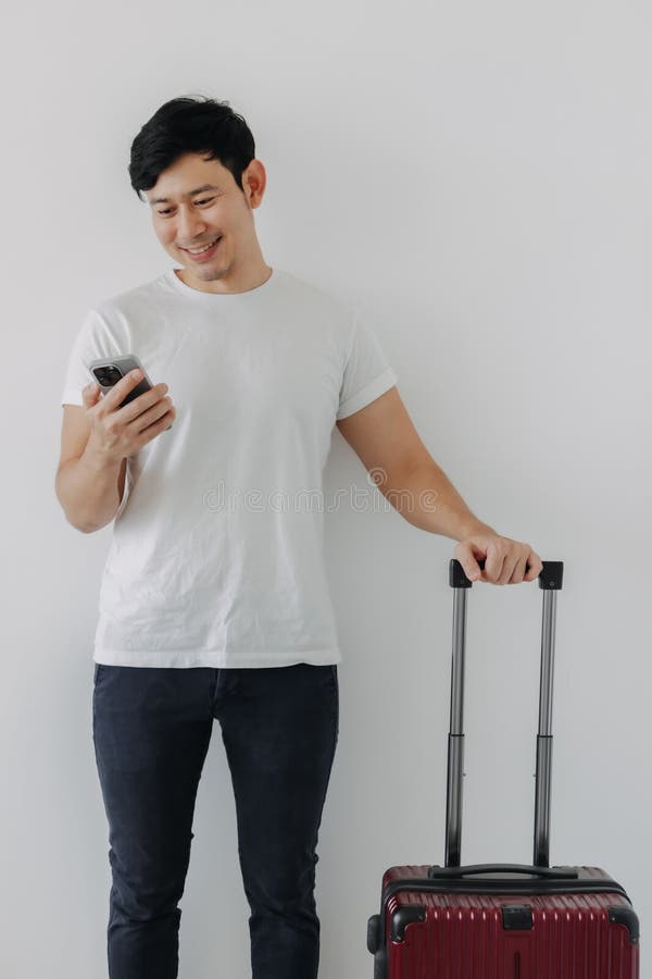 Man is Standing with a Briefcase, Using Mobile Phone. Stock Photo ...