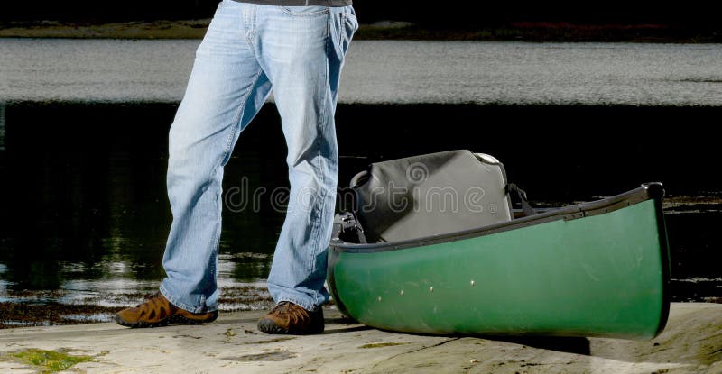 Man Standing in Canoe stock photo. Image of standing - 25524352