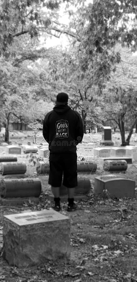 Man standing in a Cemetery stock image. Image of grief - 131869217