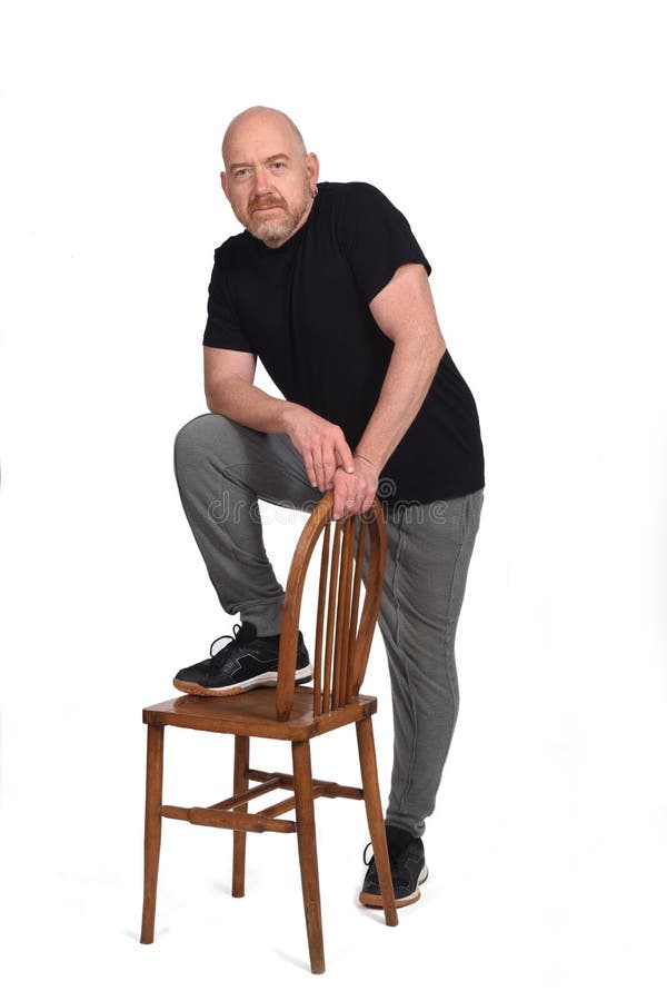 Man Standing with a Chair in White Background Stock Photo - Image of ...