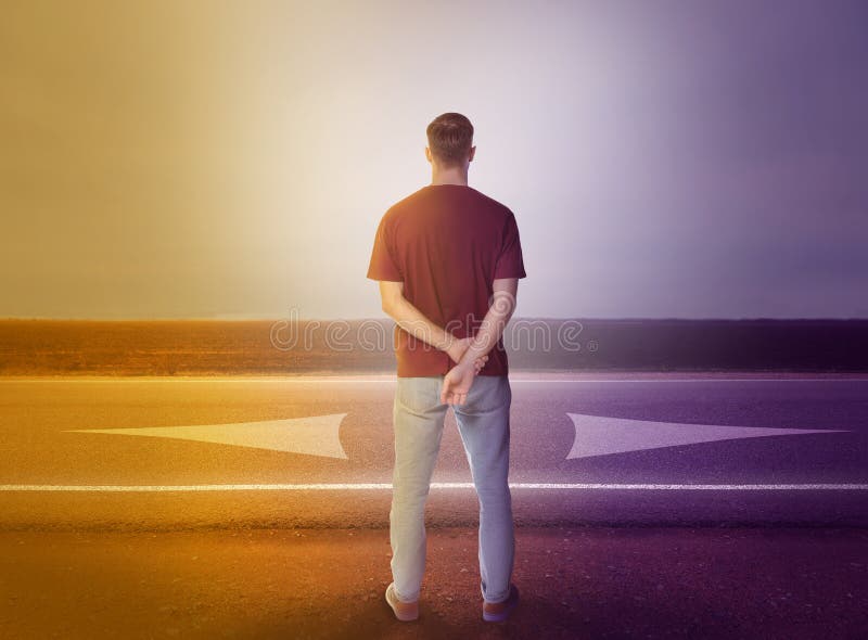 Man Standing at Crossroads. Choice between Different Ways Stock Photo ...