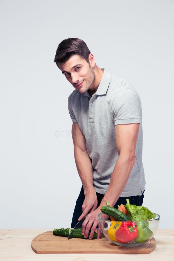 Man Standing and Cutting Vegetable Stock Photo - Image of food, people ...