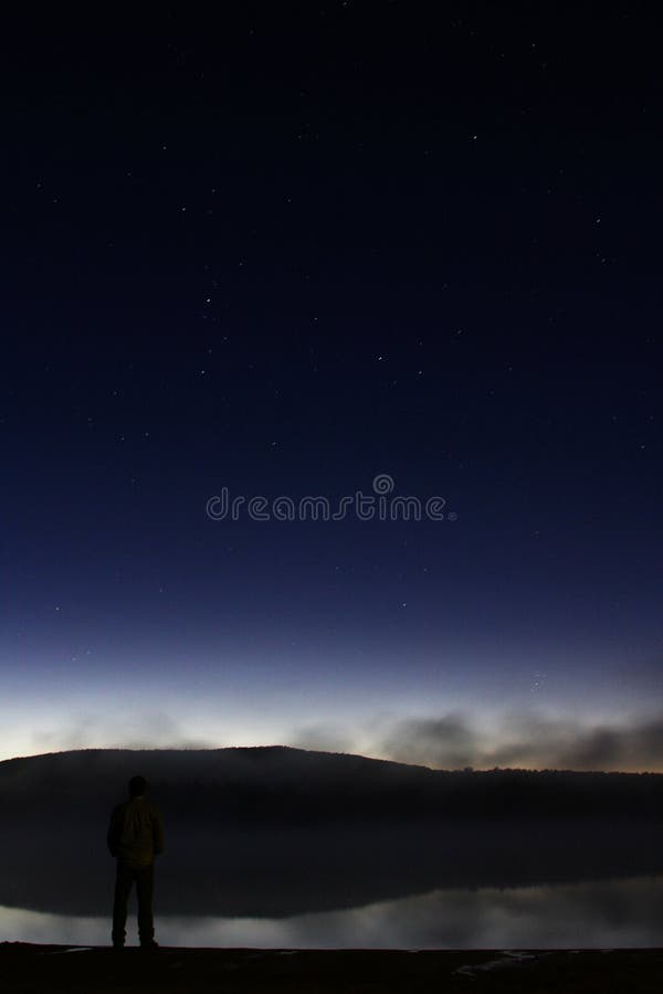 Man Standing Deep in Thought Stock Photo - Image of calm, reflection ...