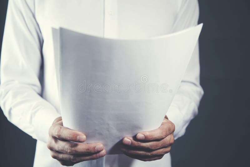 Man Standing with Document in Hand Stock Image - Image of contract ...