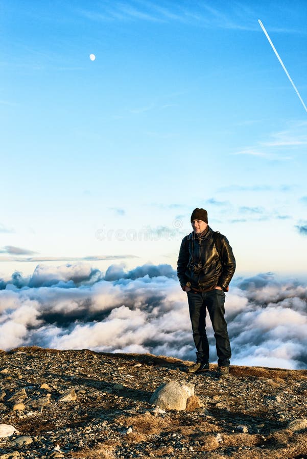 Man Standing at the Edge of a Peak Stock Image - Image of outdoor ...