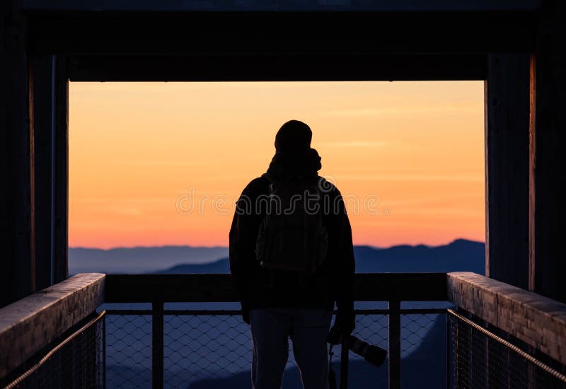 Man Standing in an Elevated Position, Gazing Out Over a Mountainous ...