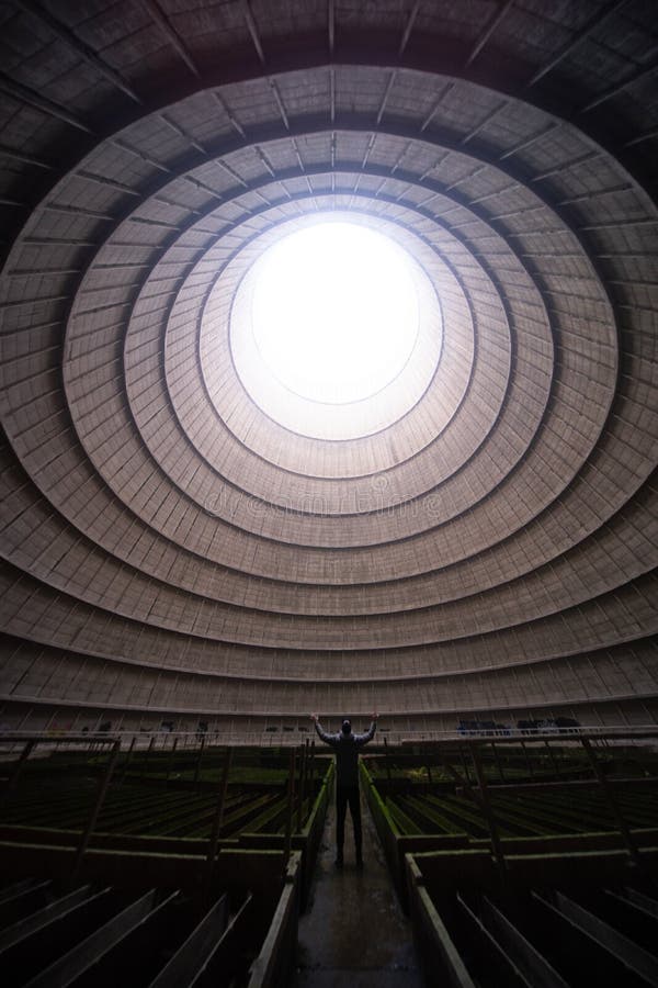 Man Standing in an Empty Hall with a Round Window on the Ceiling ...