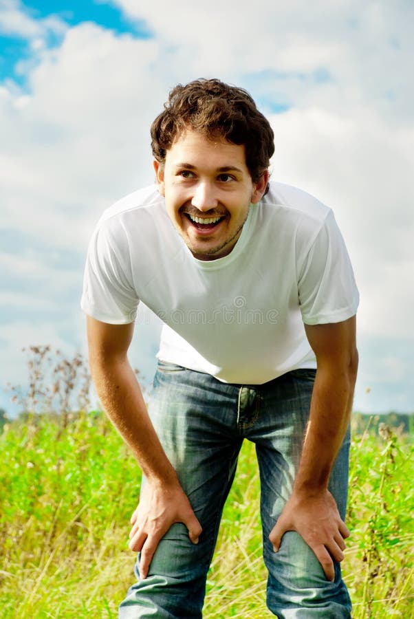 Man standing in a field stock image. Image of landscape - 20964177