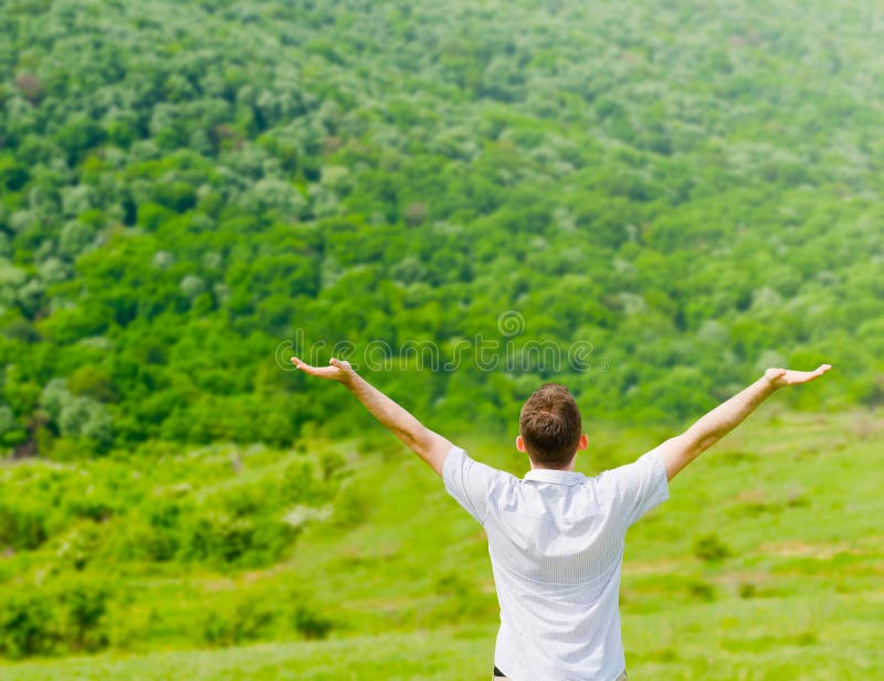 Man Standing on a Field with Arms Wide Open Stock Image - Image of ...