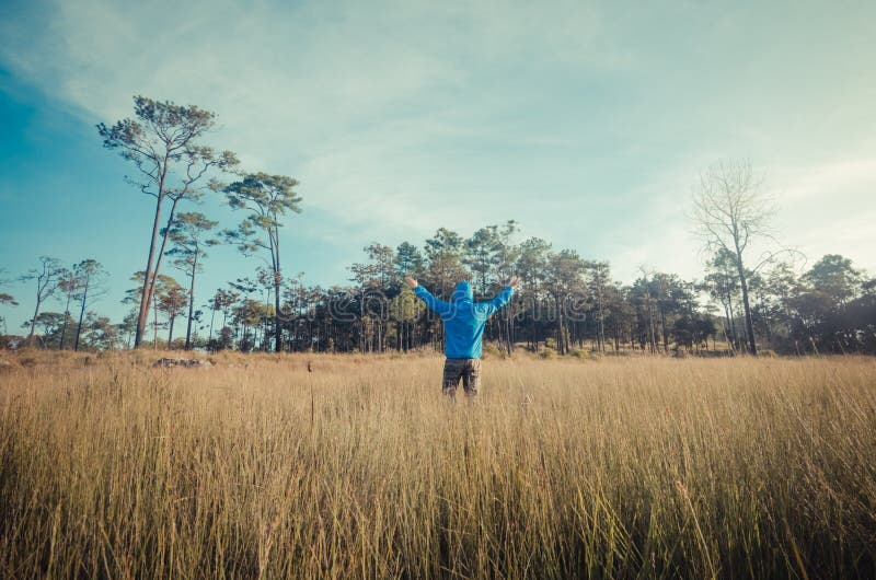 Man standing in field stock photo. Image of meadow, active - 61911320