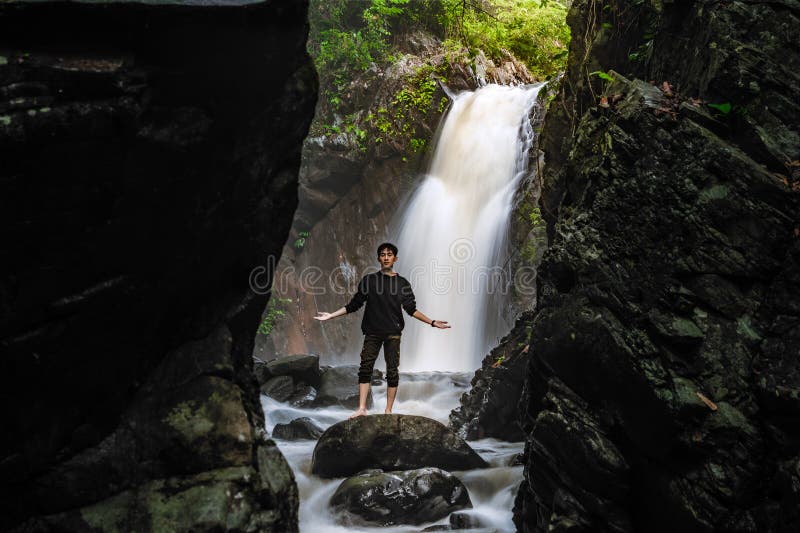 Man Standing in Front of Beautiful Waterfall. Beautiful Landscape with ...
