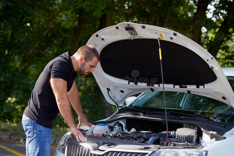 Man standing in front car stock photo. Image of transportation - 58690734