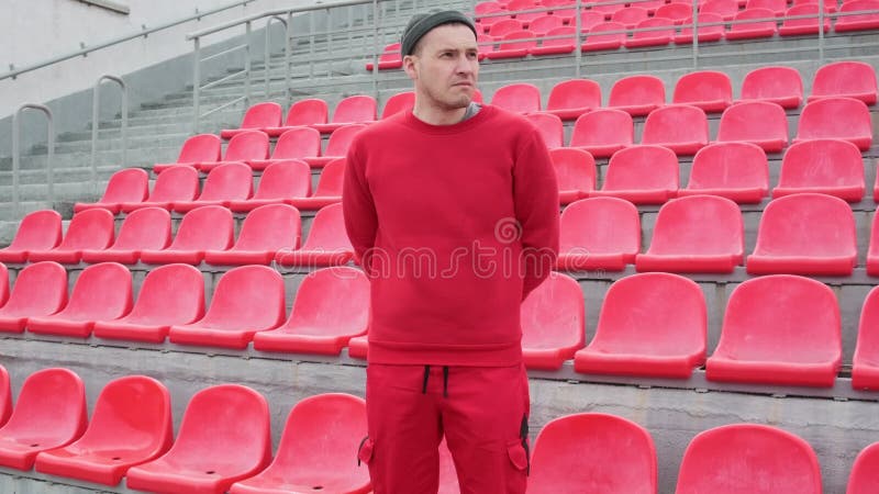 Man Standing in Front of Empty Stadium. a Man Stands Alone in Front of ...