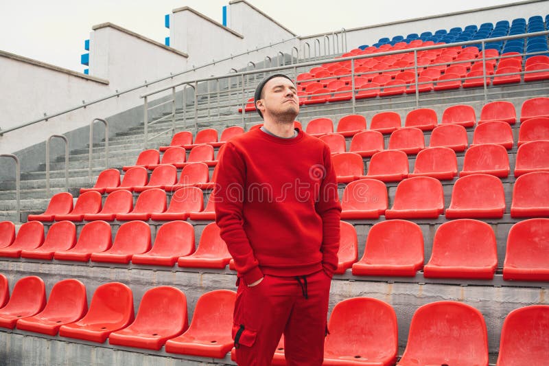 Man Standing in Front of Empty Stadium. a Man Stands Alone in Front of ...