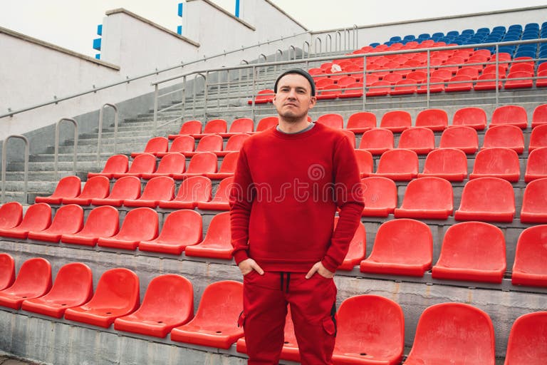 Man Standing in Front of Empty Stadium. a Man Stands Alone in Front of ...
