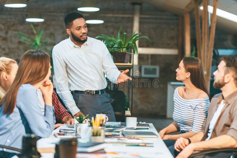 Man Standing in Front of Group of People Stock Photo - Image of ...