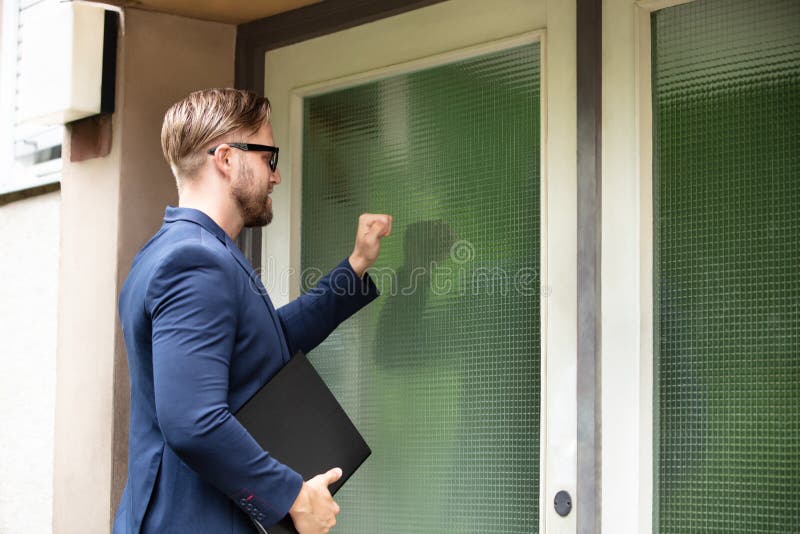 Man Standing in Front of the House Knocking the Door Stock Photo ...