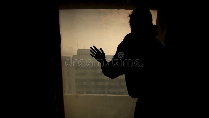 Silhouette of a Powerful Dominating Male Looking Out a Glass Window ...