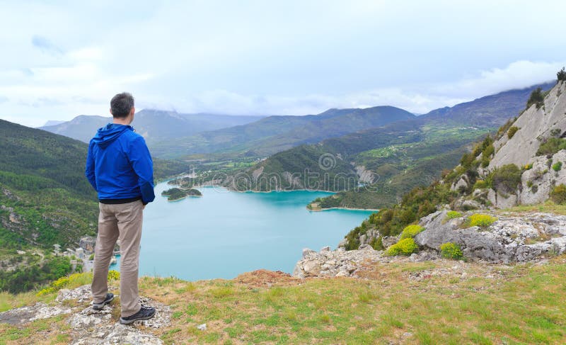 Man Standing on a Hill and Looking at a Valley Stock Image - Image of ...
