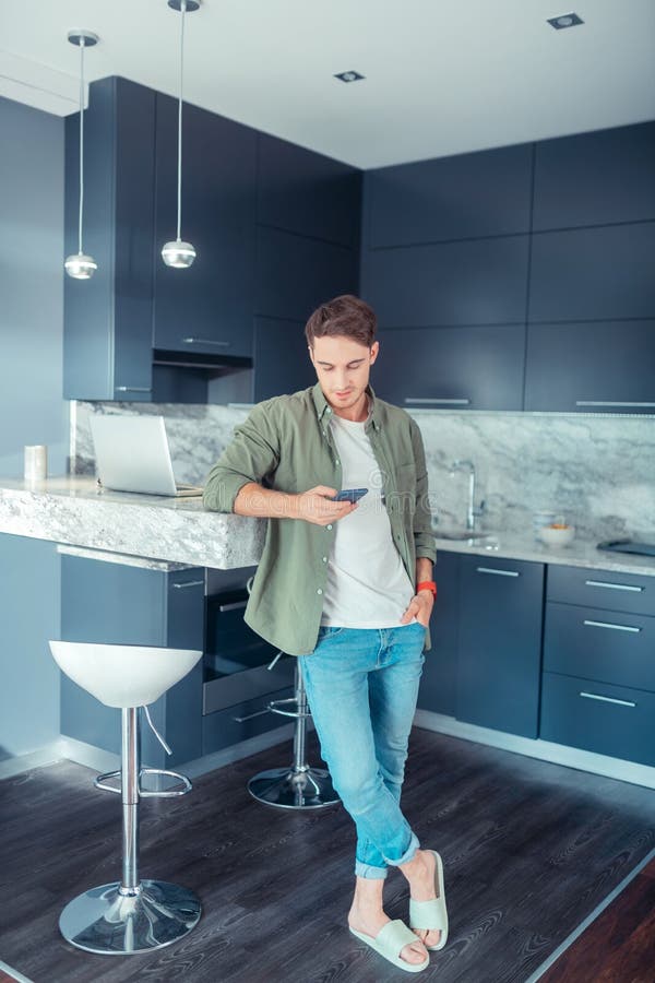 Man Standing in His Spacious Modern Kitchen Stock Photo - Image of ...