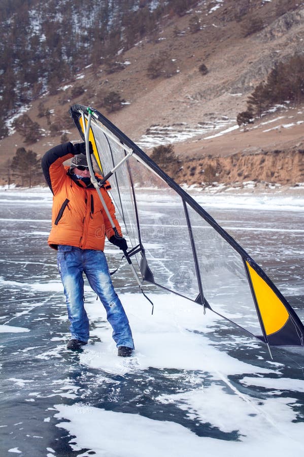 Man Standing on Ice with Wing in the Hands. Stock Photo - Image of ...