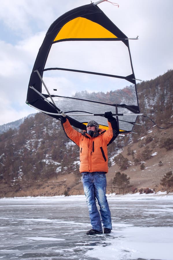 Man Standing on Ice with Wing in the Hands. Stock Image - Image of ...