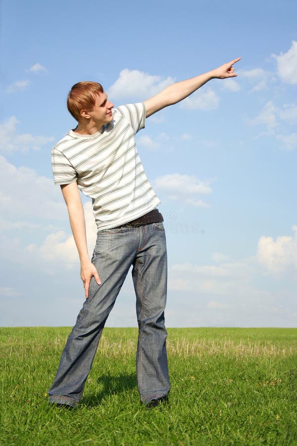 Man Standing on Lawn and Pointing for Finger Stock Photo - Image of ...