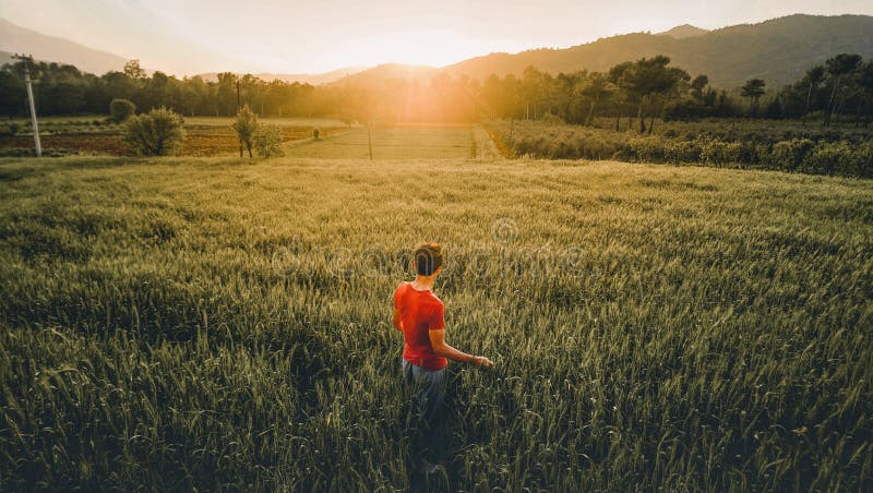 Man Standing In The Middle Of The Grass Field Stock Image - Image of ...