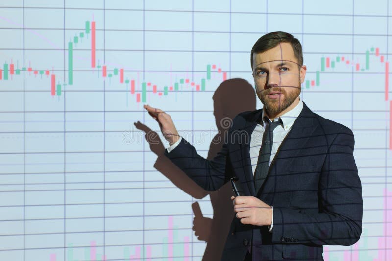 Man is Standing Near Projector and Showing Graphs and Business Graphs ...