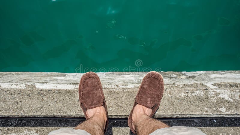 Man standing over the sea. stock image. Image of ledge - 71109229