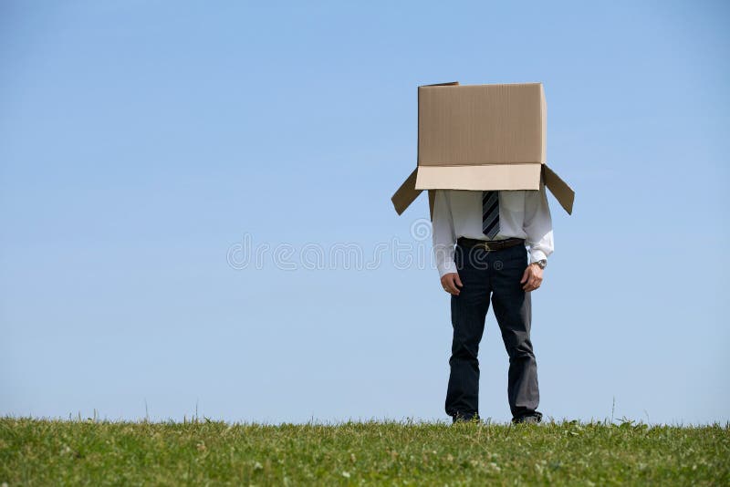 Man Standing in Park with Cardboard Box Over His Head Stock Image ...