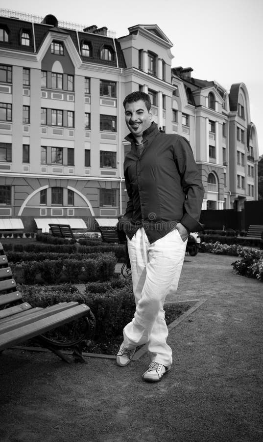 Man Standing in Park Near Bench Stock Image - Image of bench, city ...