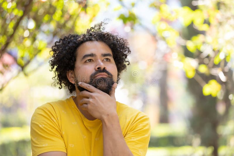 Man Standing at the Park while Thinking and Looking Off into the ...