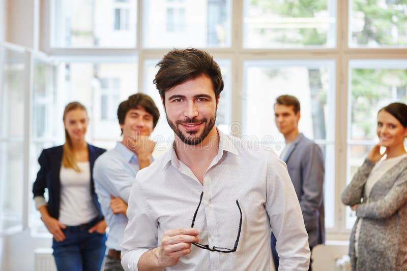 Man Standing Proud in Front of Team Stock Image - Image of competence ...