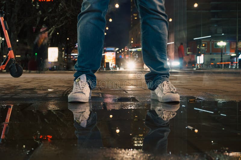 A Man Standing at a Puddle during Night Stock Photo - Image of night ...