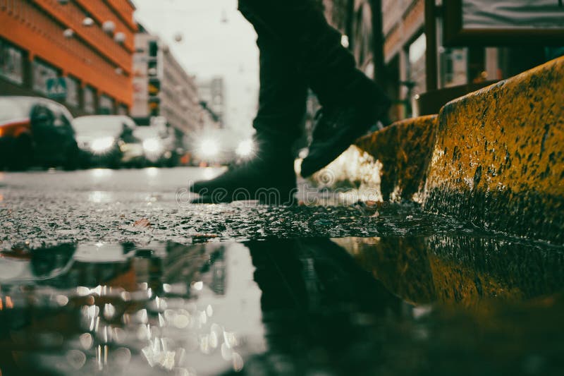 A Man Standing at a Puddle on a Street Stock Image - Image of puddle ...