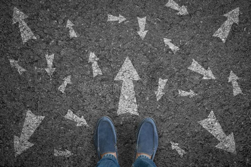 Man Standing on Road with Many Direction Arrow Choices or Move Stock ...