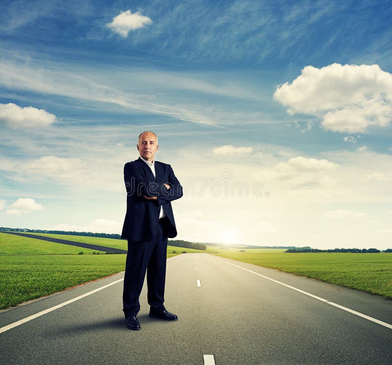 Man standing on the road stock image. Image of distant - 34571417