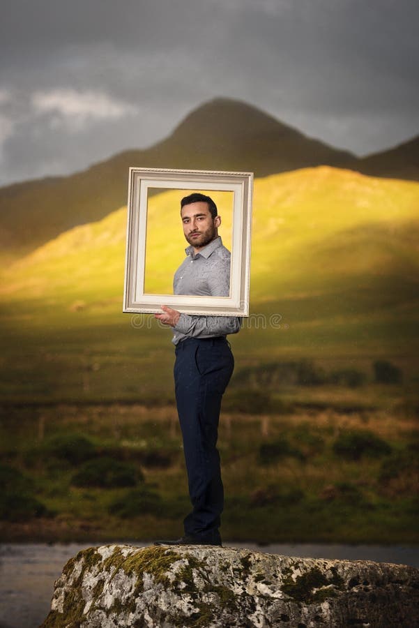 A man with a frame stock photo. Image of navy, standing - 123514174