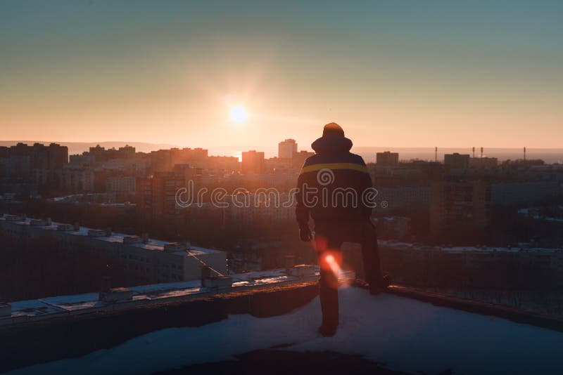 A man standing on the roof stock image. Image of adult - 108790243