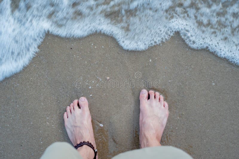 Man standing in sand stock image. Image of standing - 148559993