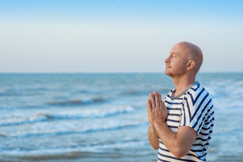 Man is Standing by the Sea and Praying To God Stock Image - Image of ...