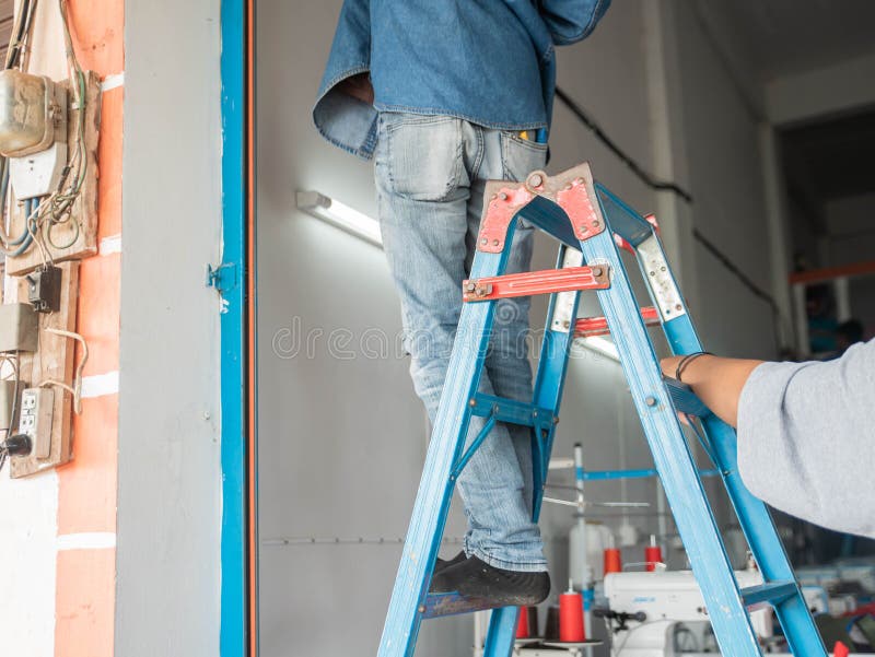 Man Standing on Steel Ladder Stock Image - Image of profession, human ...