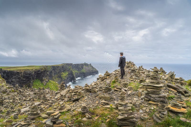 Man Standing between Stone Stackings and Admiring View on in Iconic ...