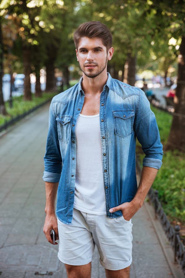 Man standing on the street stock image. Image of outdoors - 78062707