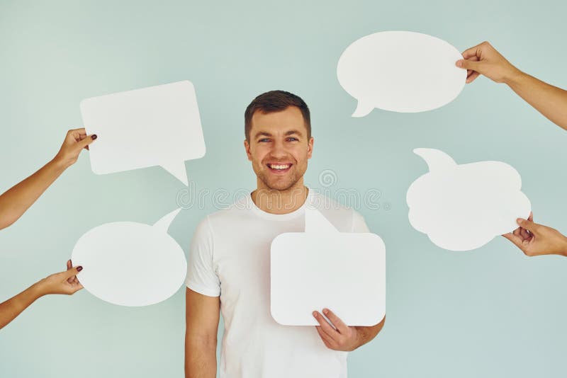 White Hard Hat and Blue Uniform. Man Standing in the Studio with Empty ...
